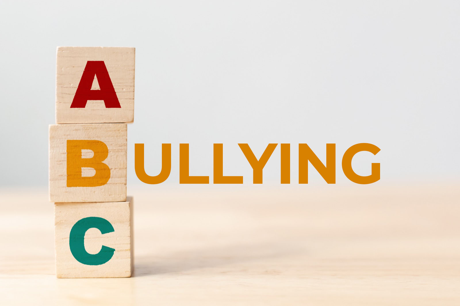 ABC letters alphabet on wooden cube blocks in pillar form on wood table ...